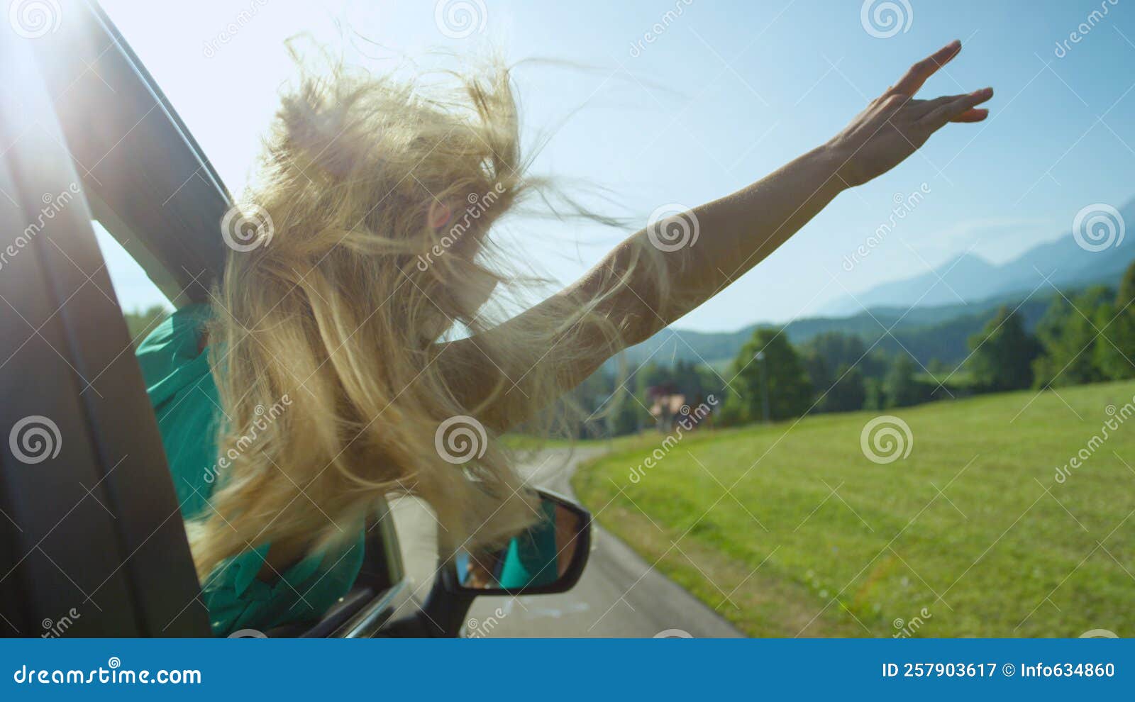 Lens Flare Unrecognizable Blonde Woman Waves Her Arm Through Air While