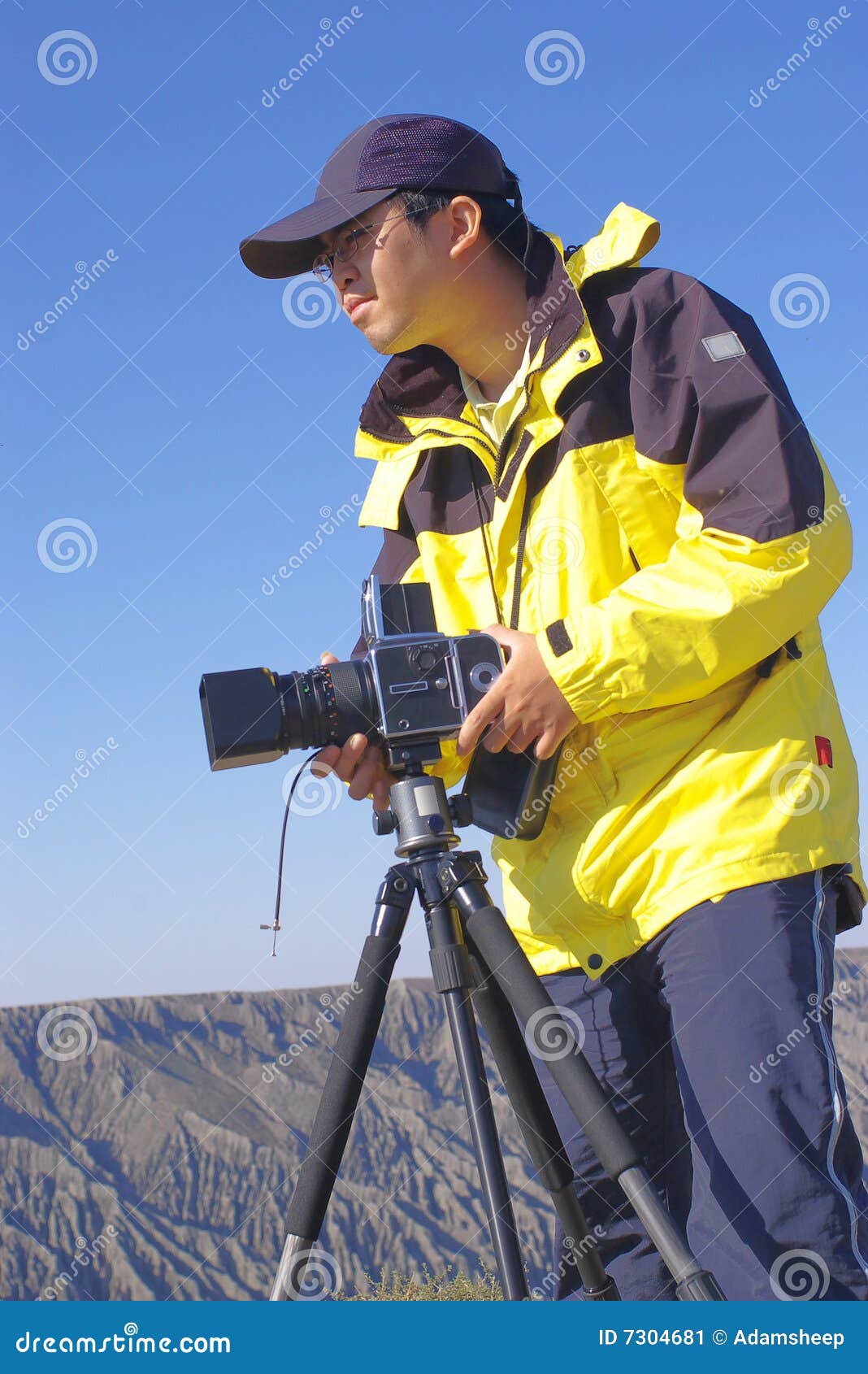 Lensman and his camera stock image. Image of lensman, graveness - 7304681
