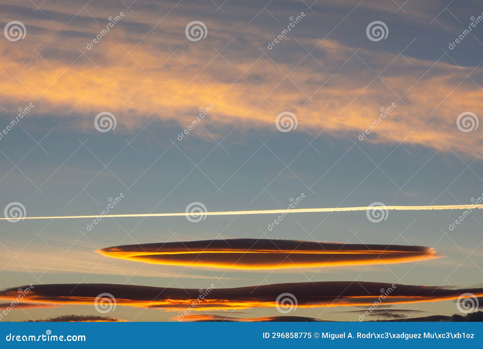 Lenticular Clouds and Cirrus Clouds in the Sky with the Moon Stock ...