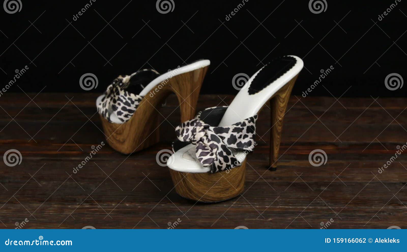 Leopard Clogs with High Heels and a Platform on a Wooden Background ...