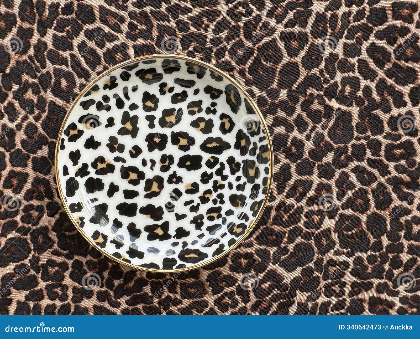 Leopard Print Plate on Leopard Print Textile Stock Image - Image of ...