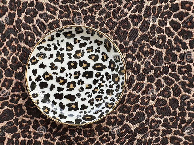 Leopard Print Plate on Leopard Print Textile Stock Image - Image of ...
