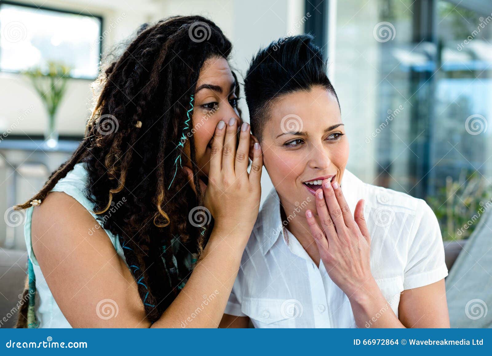 Lesbian Couple Whispering in Ears Stock Photo - Image of curly, focus ...