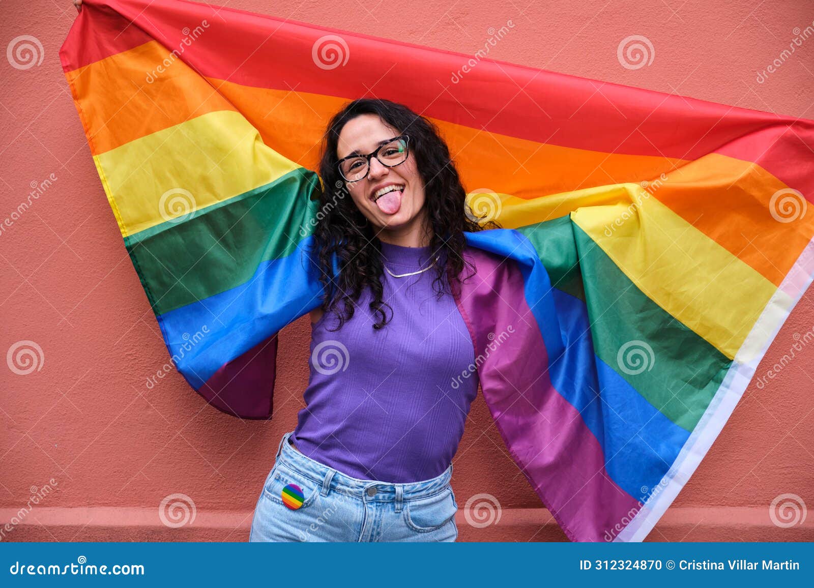 Lesbian Woman Is Holding A Rainbow Flag And Smiling Celebrating Pride