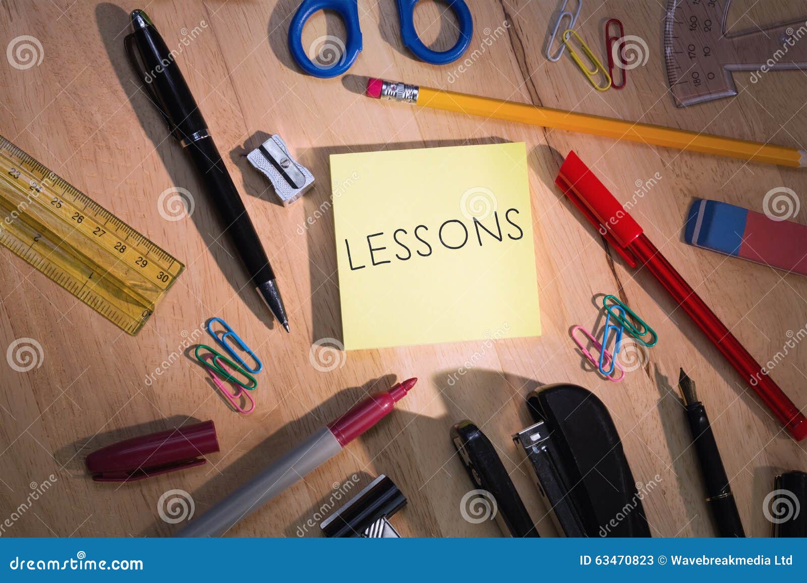 Lessons Against Students Table with School Supplies Stock Image - Image ...