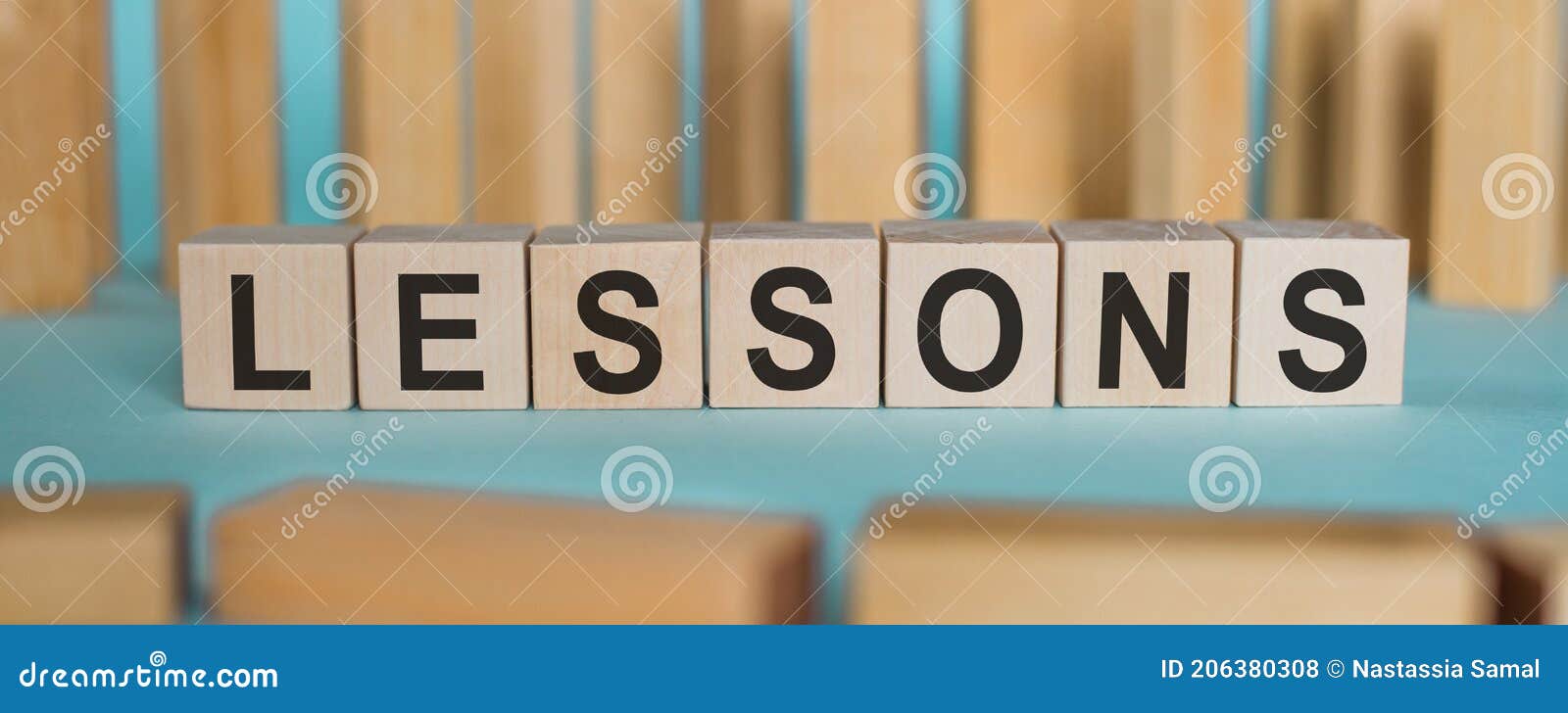 LESSONS Word Written on Wooden Blocks on Light Blue Background Stock ...