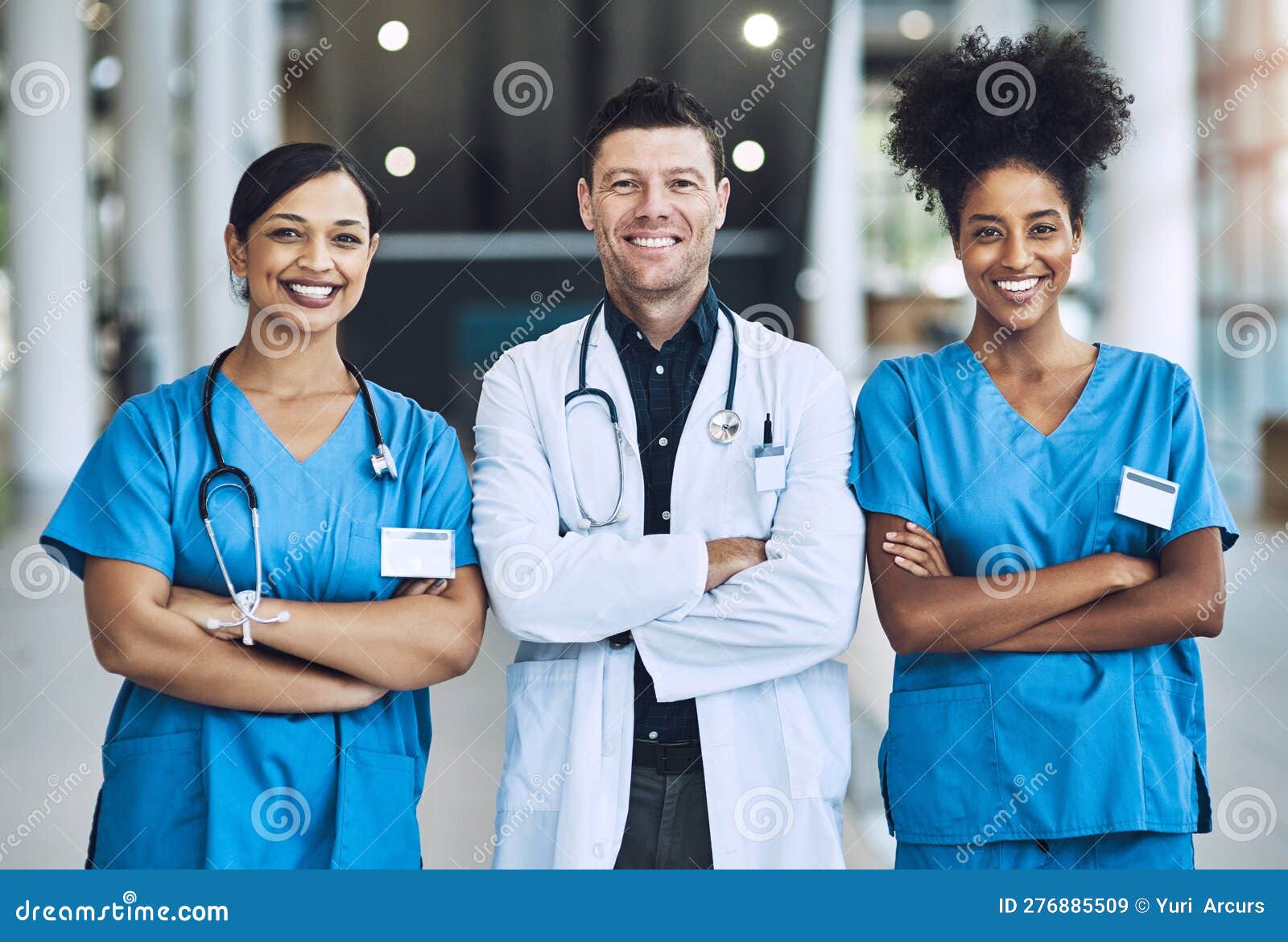 Let the Experts Take Care of You. Three Medical Practitioners Standing ...