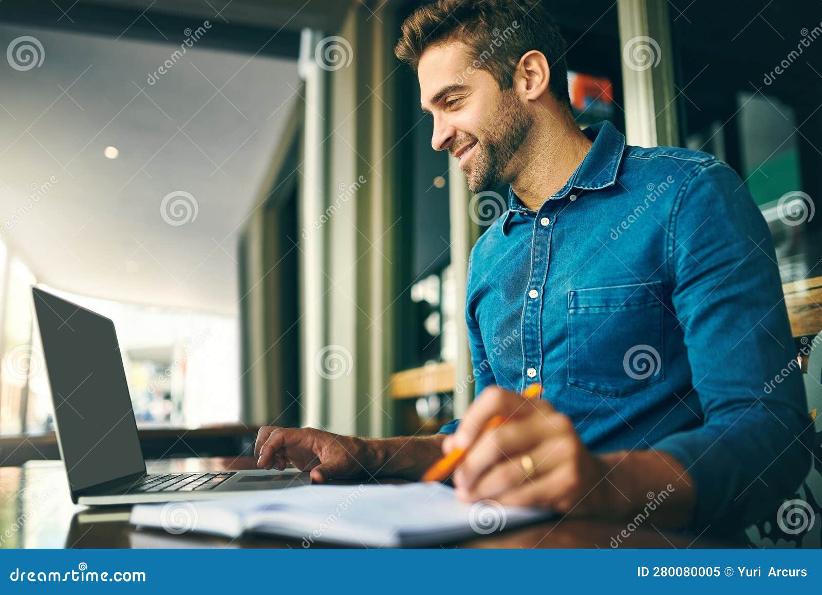 Let Me Write that Down. a Handsome Young Businessman Sitting Alone and ...