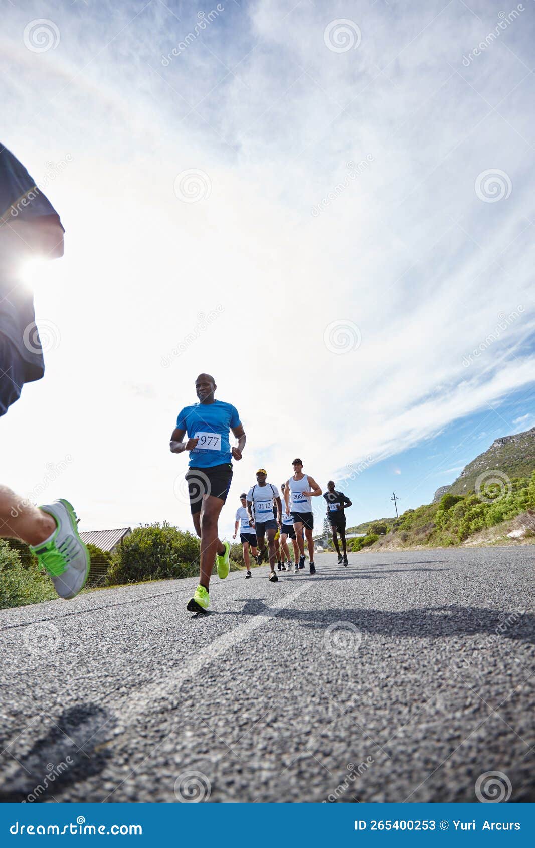 Let Us Run with Perseverance. a Group of Young Men Running a Marathon ...