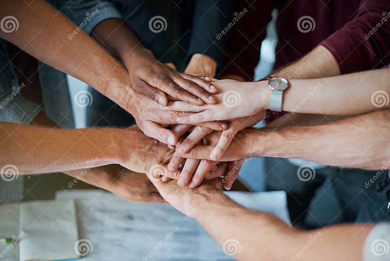 Lets Band Together As One A Group Of Unrecognisable Businesspeople Joining Their Hands Together