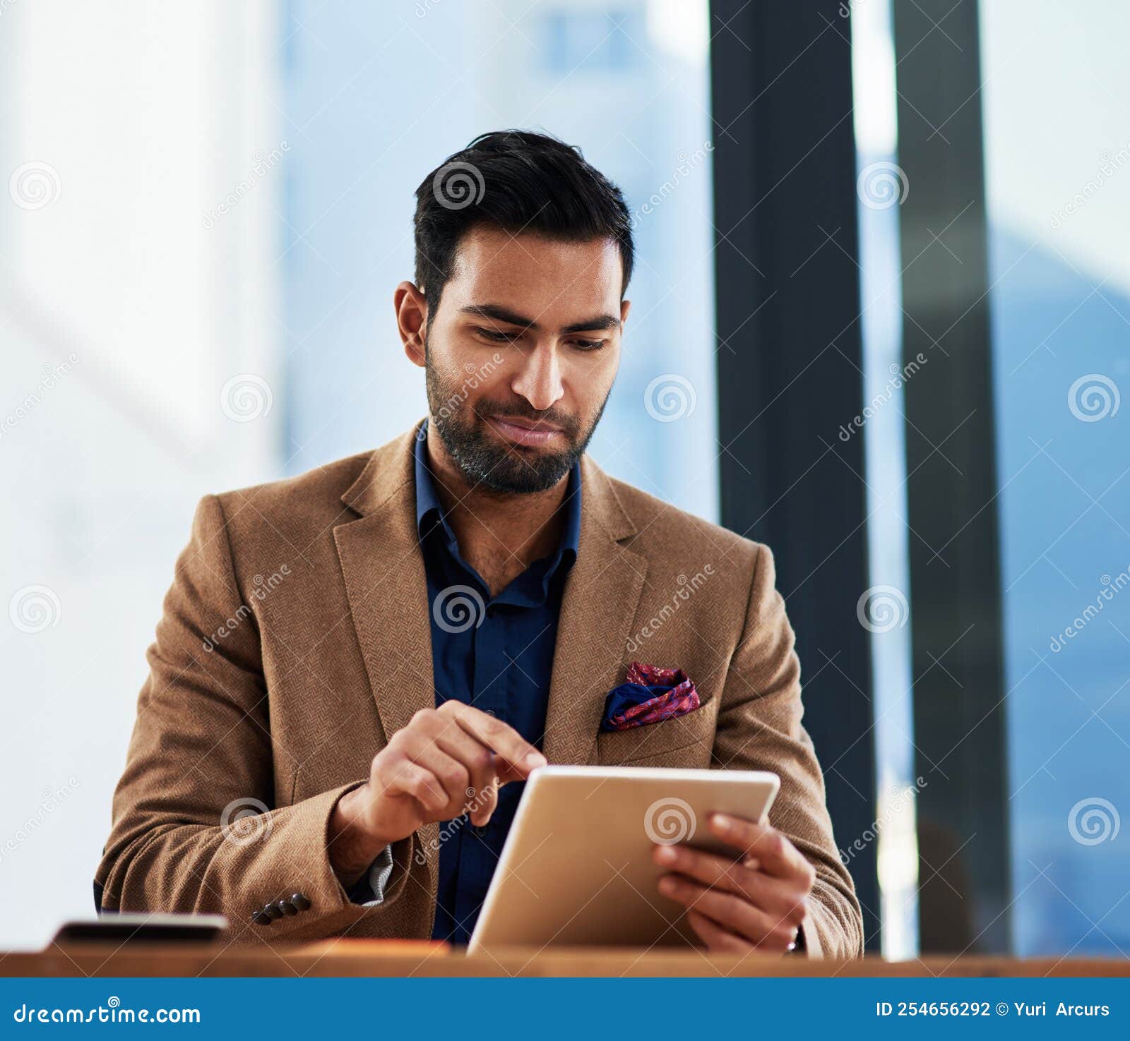 Lets Boost Productivity with this Little Device. a Young Businessman ...