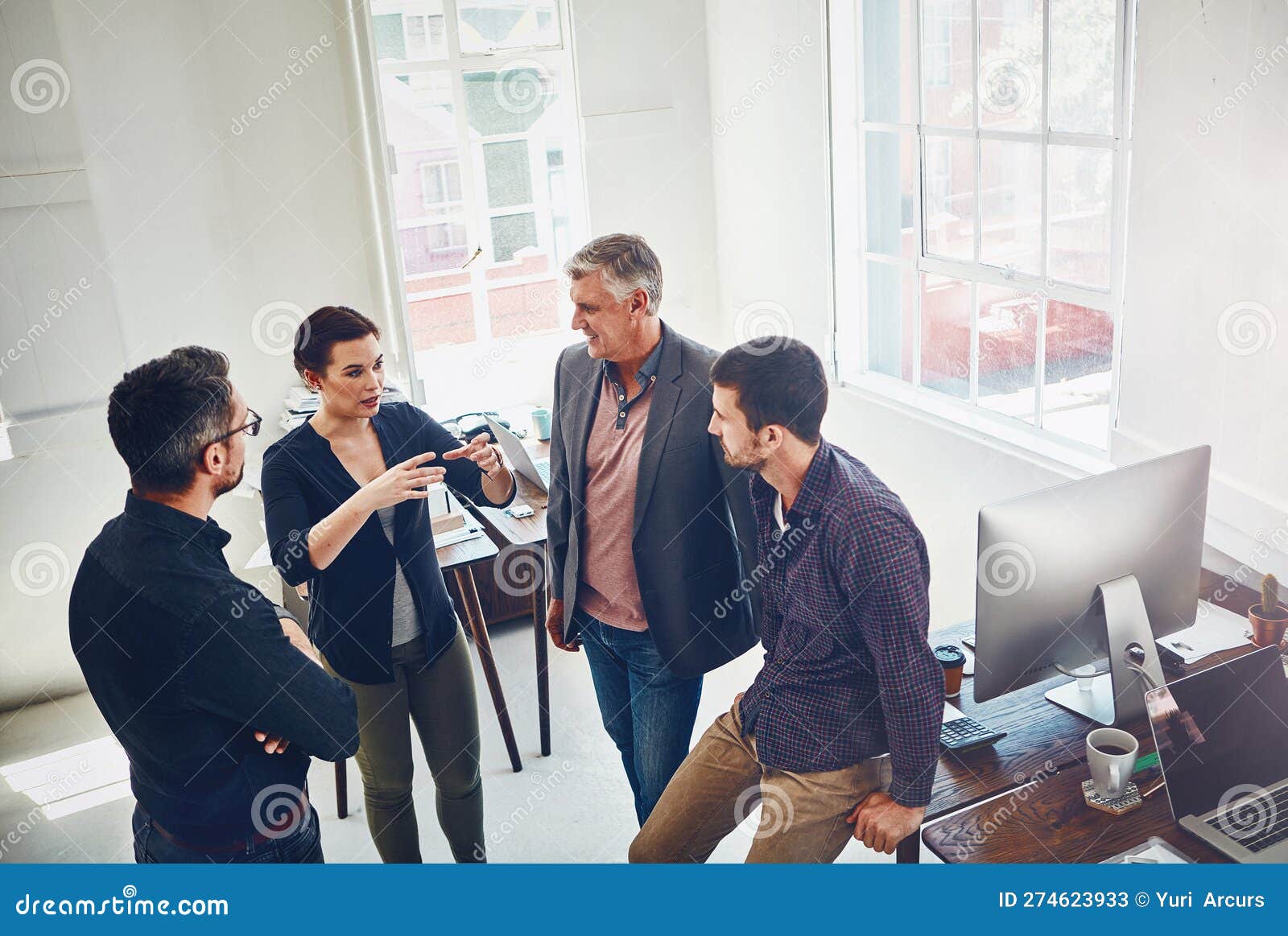 Lets Discuss the Challenge at Hand. a Group of Designers Having a ...