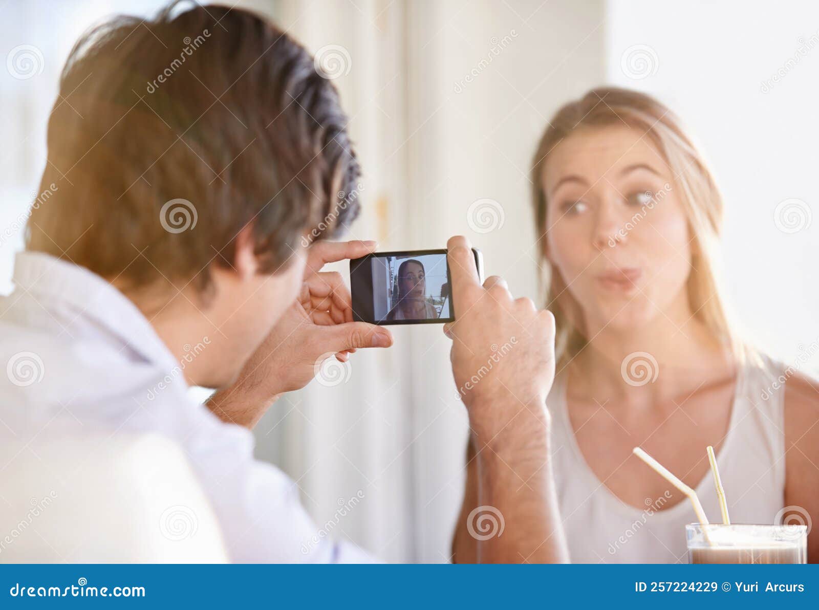 Lets Do a Fun One. a Young Man Snapping a Picture of His Girlfriend ...