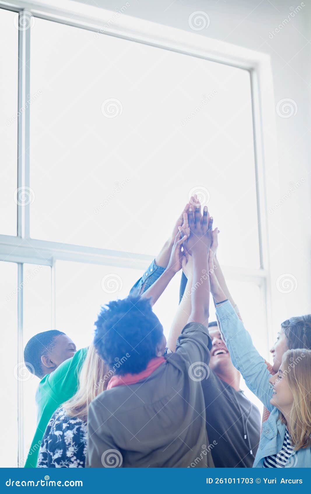 Lets Do this. a Group of University Students High Fiving One Another ...