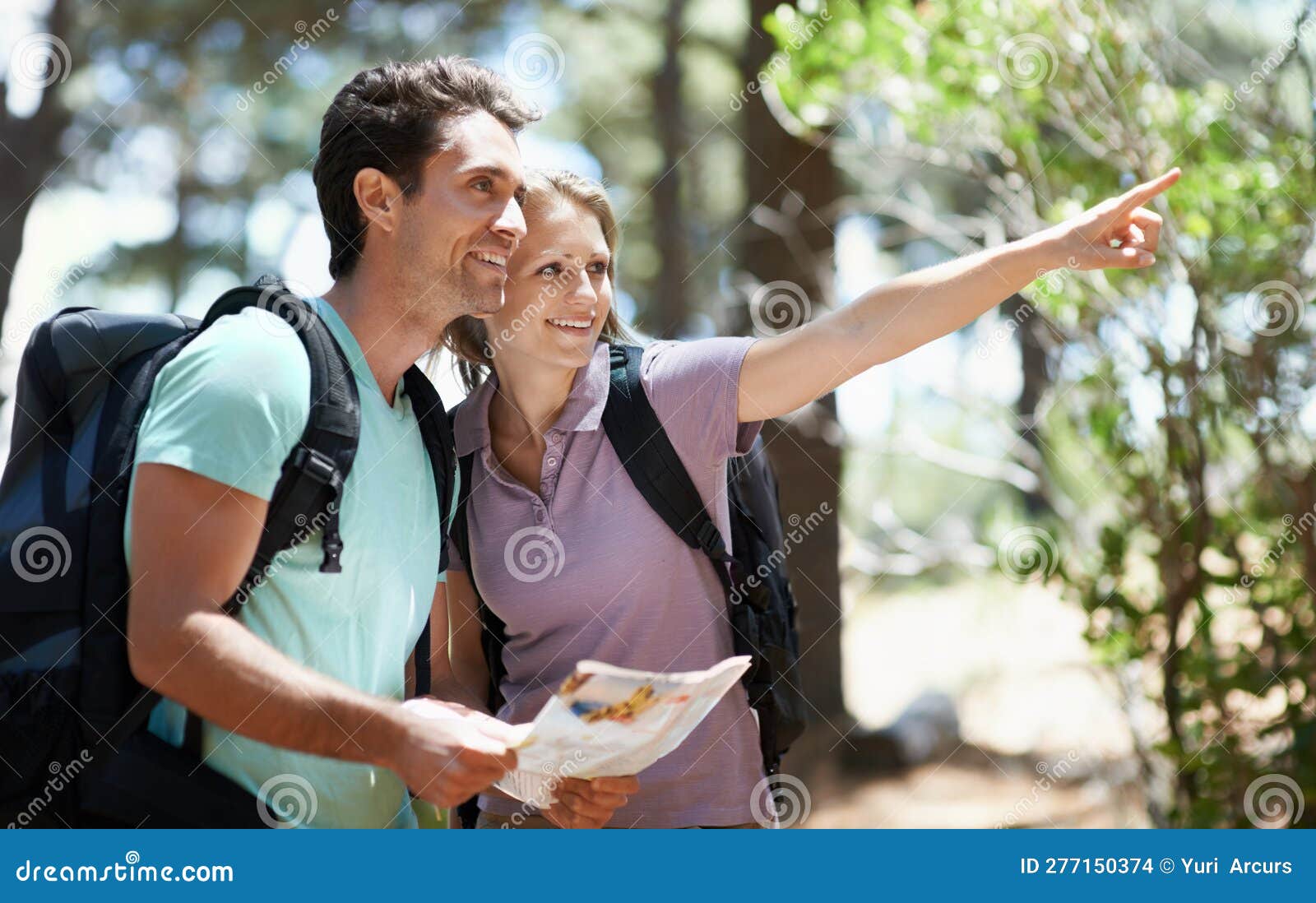 Lets Explore that Trail. a Happy Young Couple Backpacking through the ...