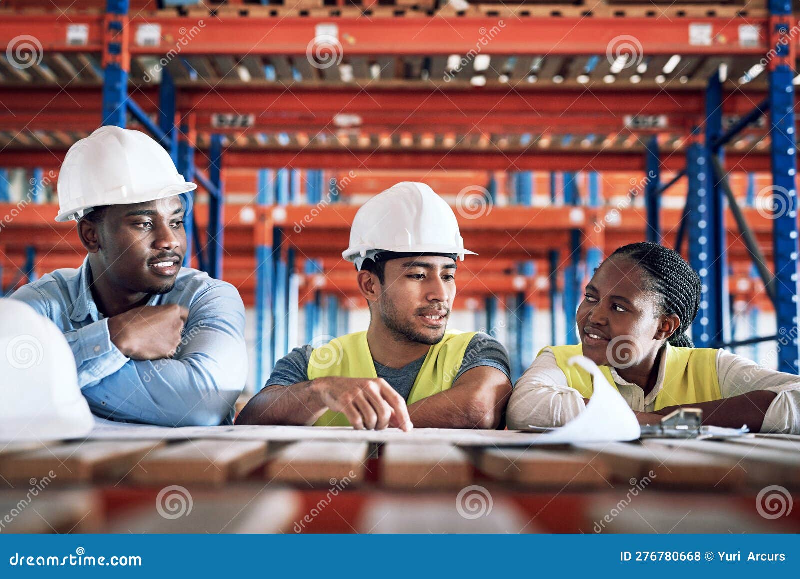 Lets Get it Done and Get it Done Safely. a Group of Builders Having a ...