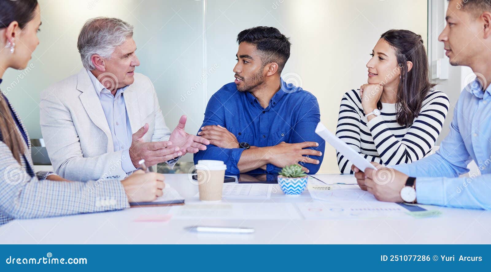 Lets Get on the Same Page. Shot of a Group of Businesspeople Having a ...