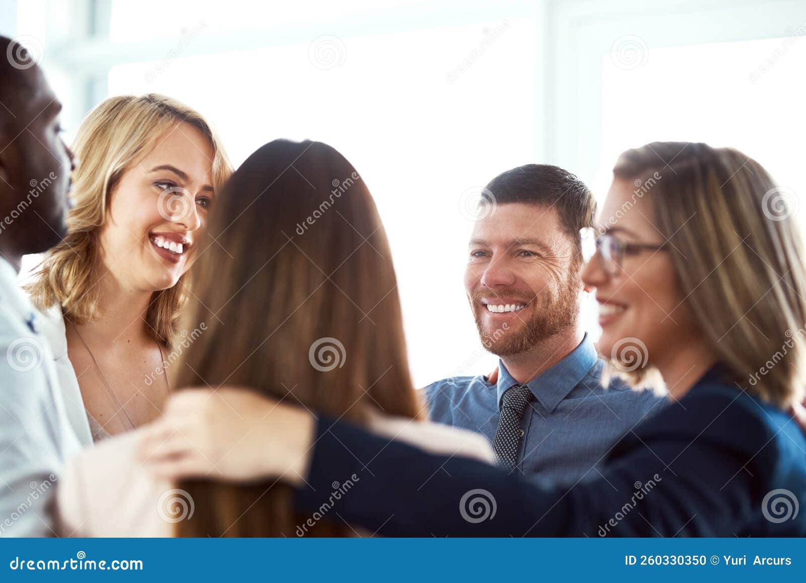 Lets Get Together. a Group of Work Colleagues Forming a Huddle Together ...