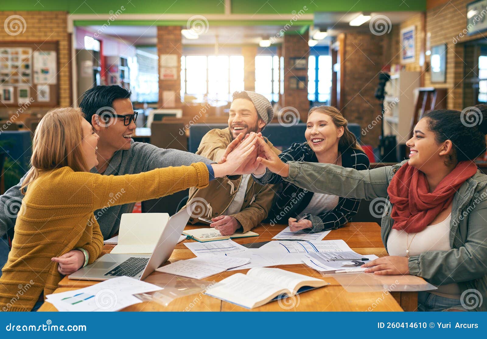 Lets Get Working. a Cheerful Young Group of Students Forming a Huddle ...