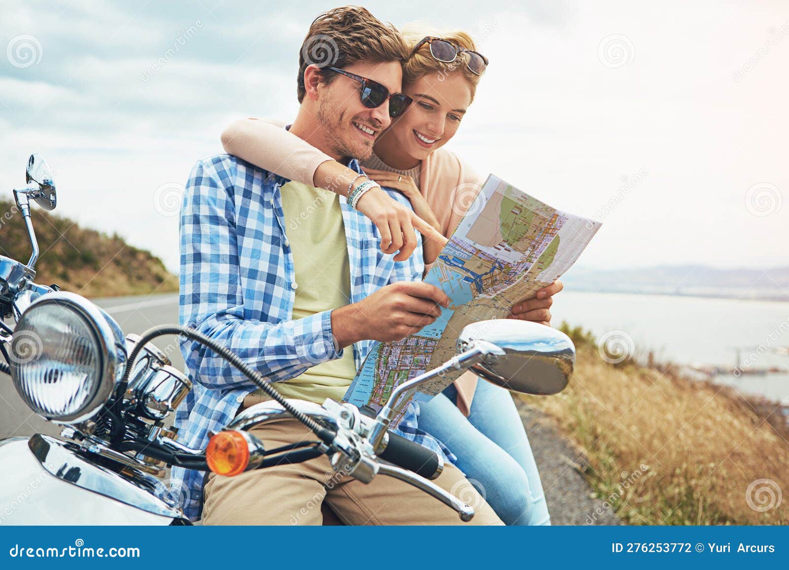 Lets Go There. a Couple Using a Map while Out on a Road Trip. Stock ...