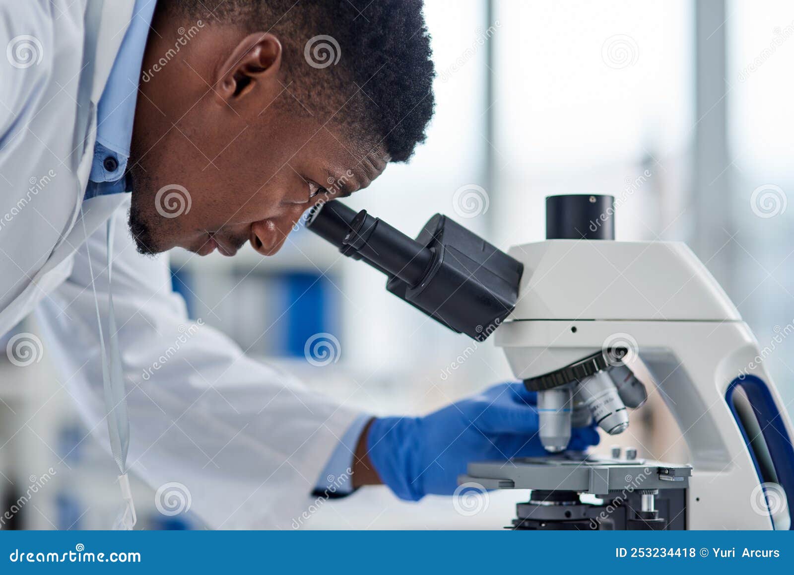 Lets Have a Look. a Focused Young Male Scientist Looking at Test ...