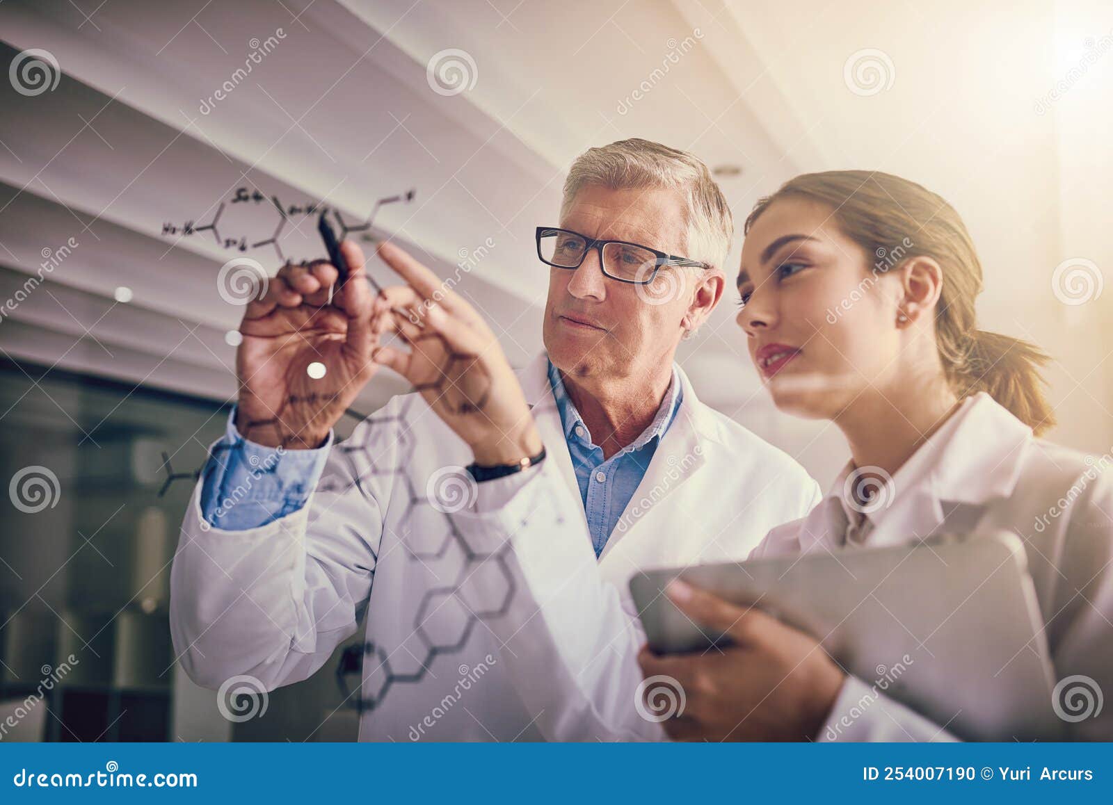 Lets Start Here. Two Focused Scientists Working Together Solving ...