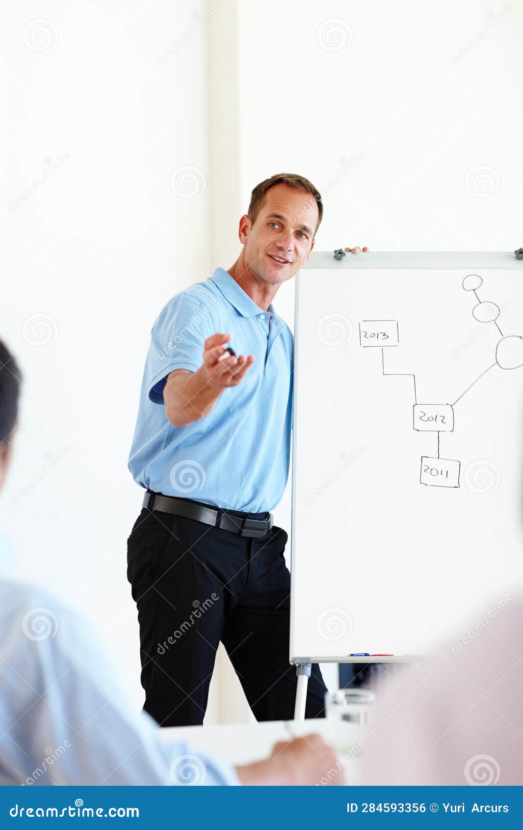 Lets Start with Your Suggestion. Shot of a Handsome Man Doing a ...