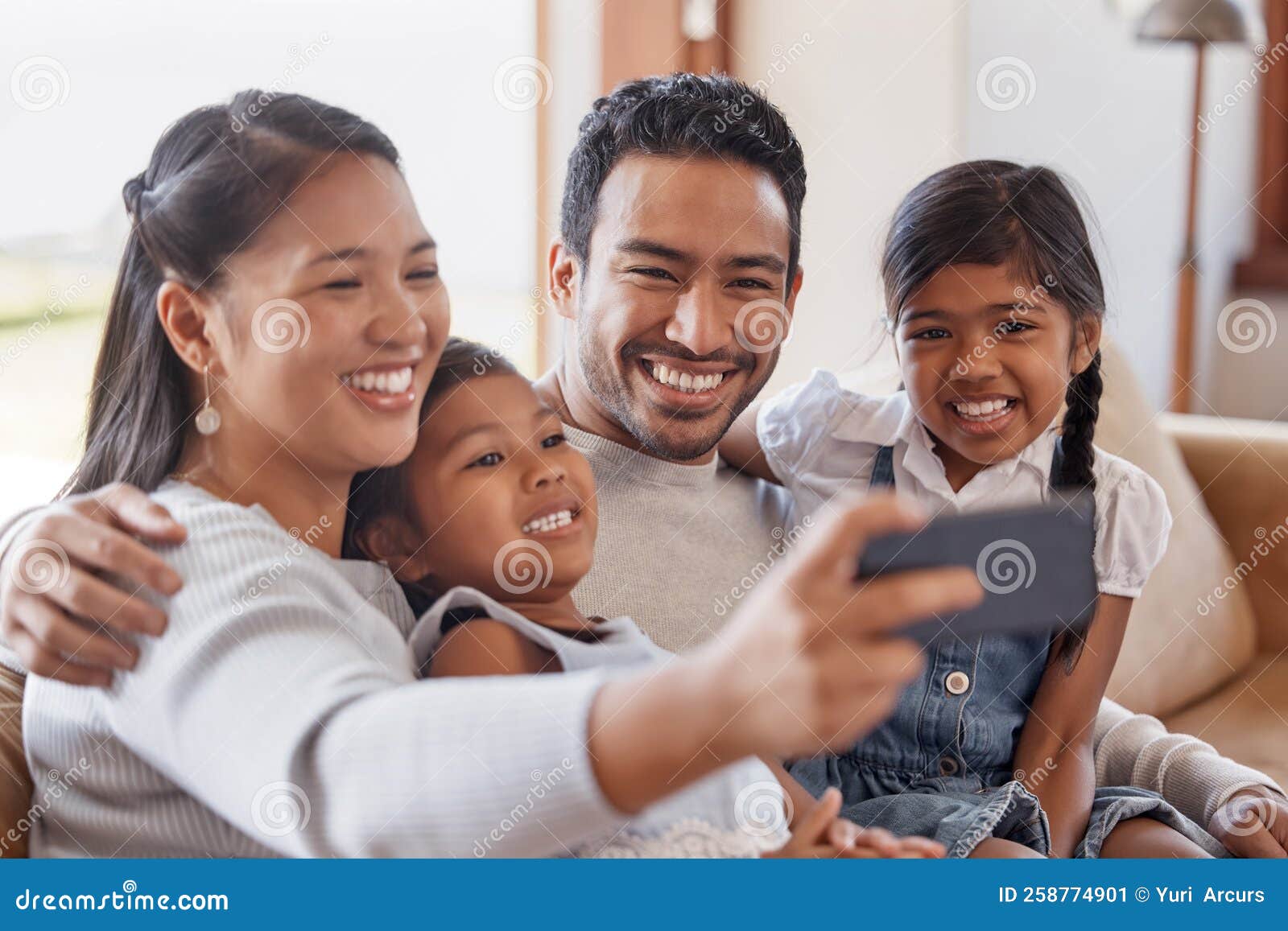 Lets Take a Selfie. an Affectionate Young Family of Four Taking Selfies ...