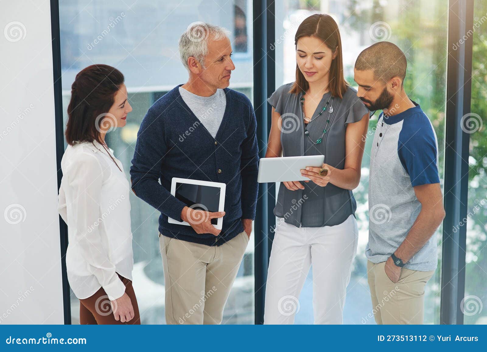 Lets Talk Shop. a Group of Colleagues Having a Conversation Over a ...