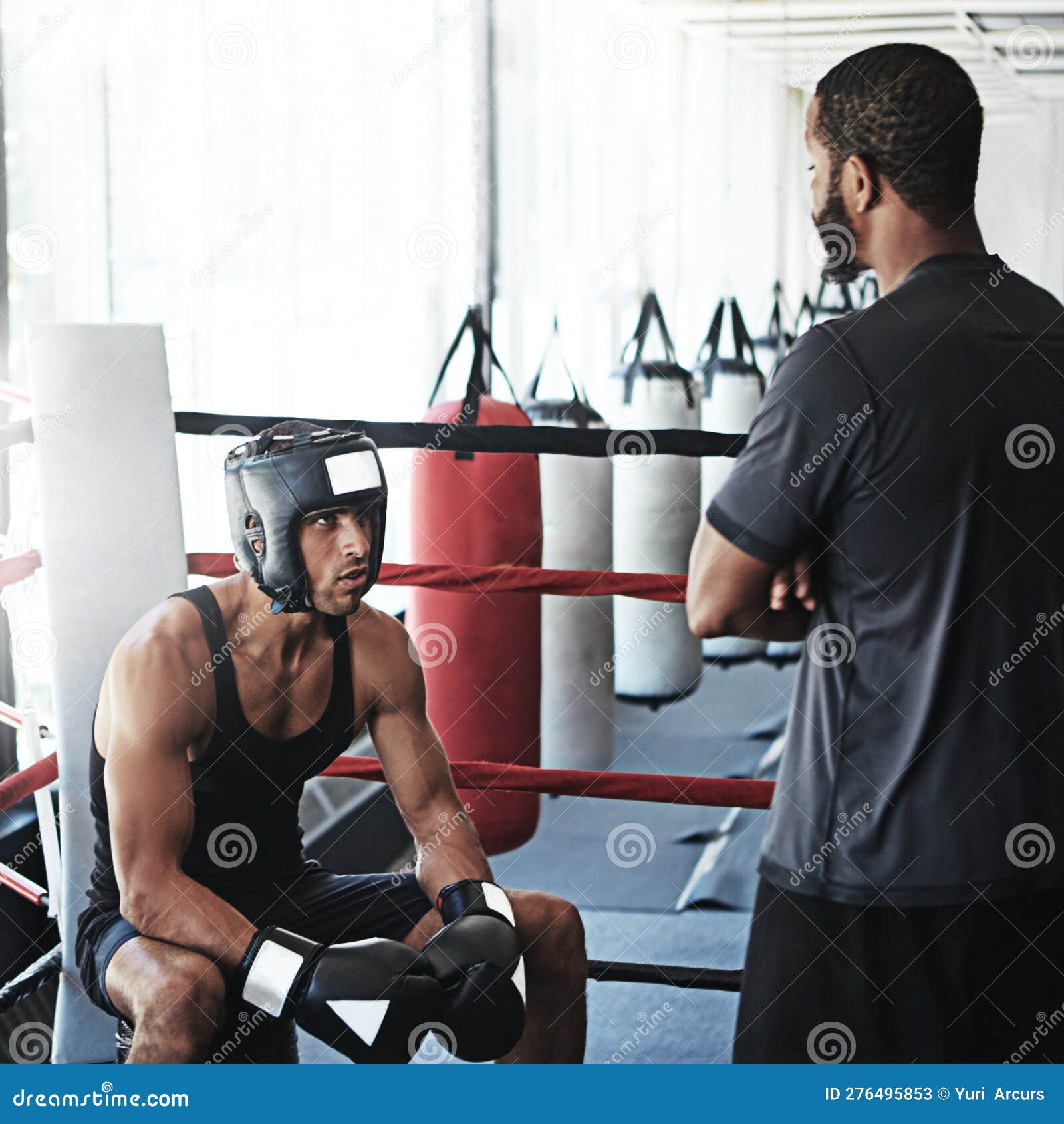 Lets Talk about Tactics. a Man Training in the Boxing Ring with a Coach ...