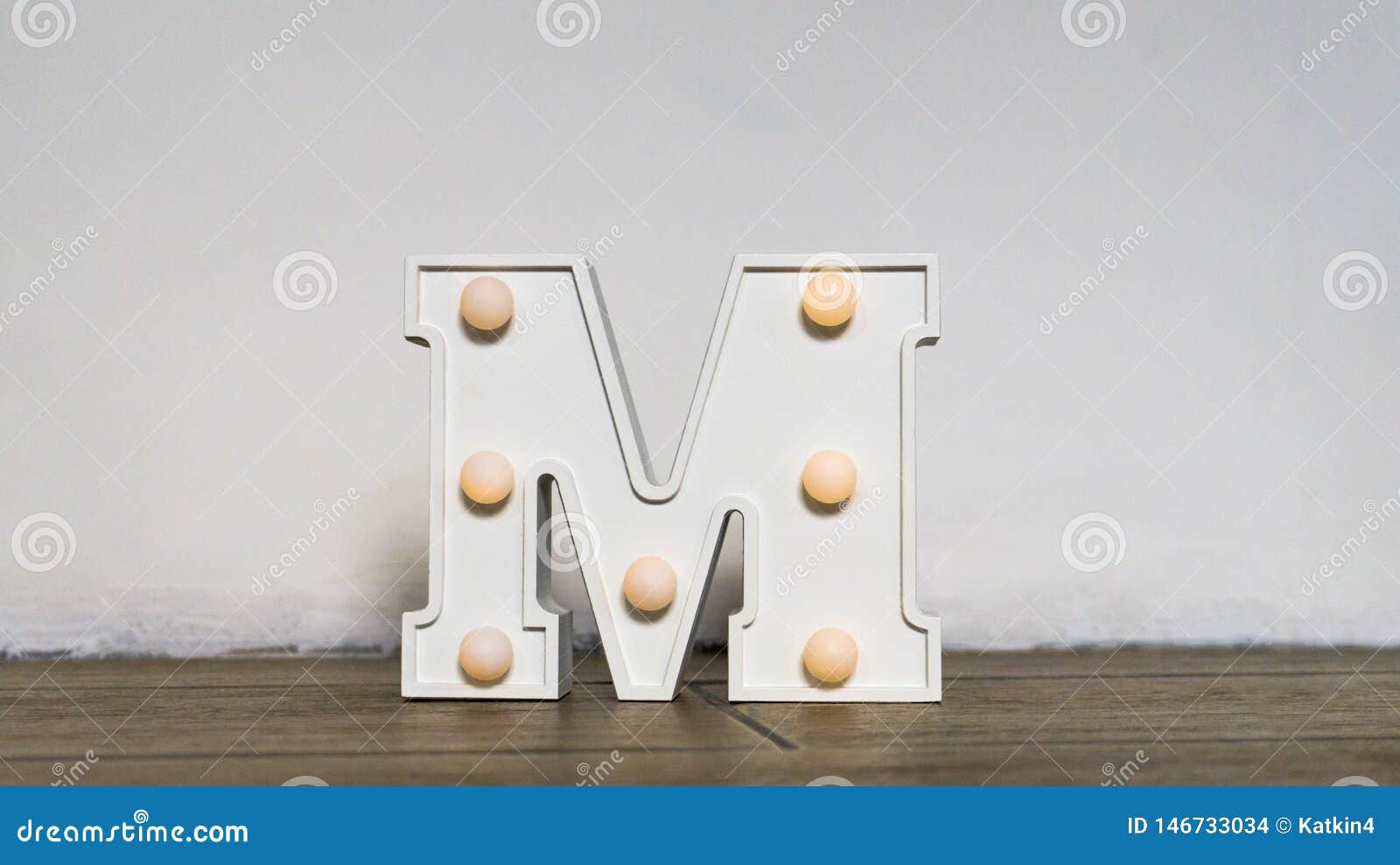 Letter of the Alphabet. Night Light in the Nursery. White Letter M with ...