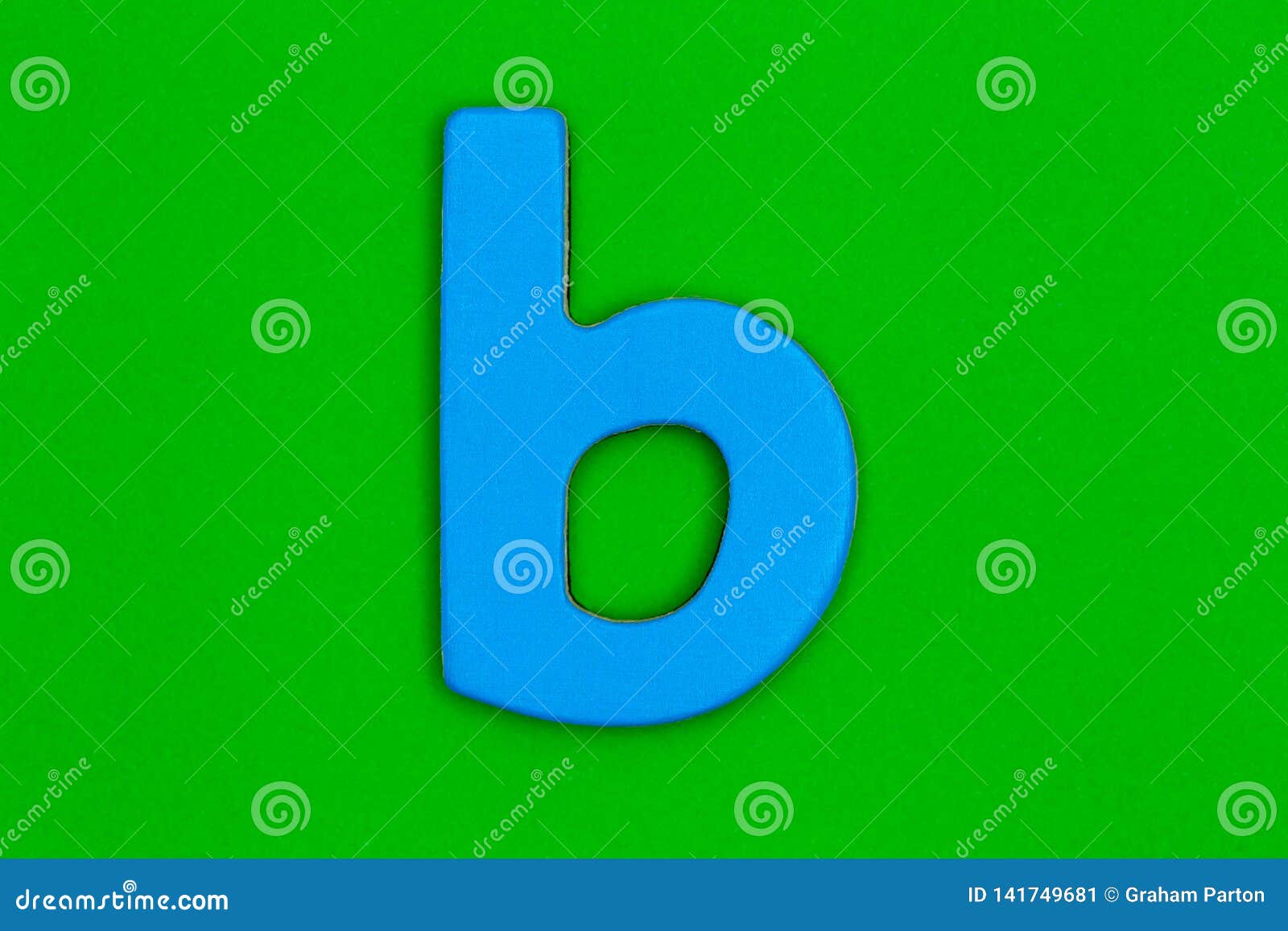 Letter B Made of Wood Painted Blue on Green Background Stock Image ...