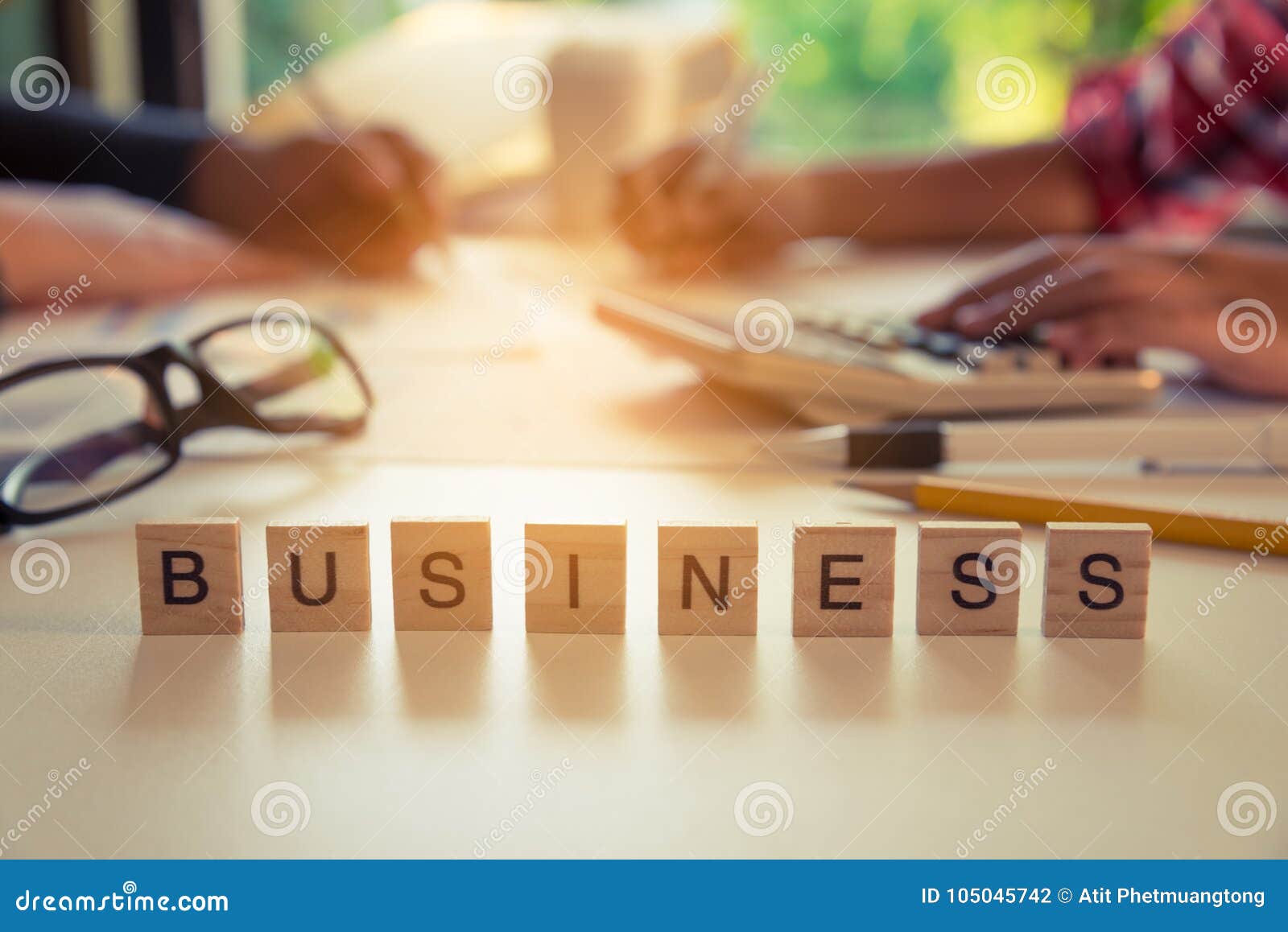 The Letter `BUSINESS` is on the Table with Business People Working ...
