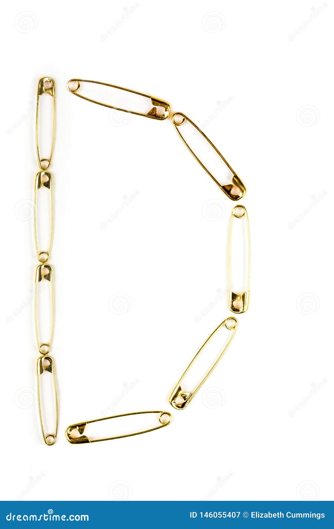 Letter Spelled Out in Gold Colored Safety Pins Stock Image - Image of ...