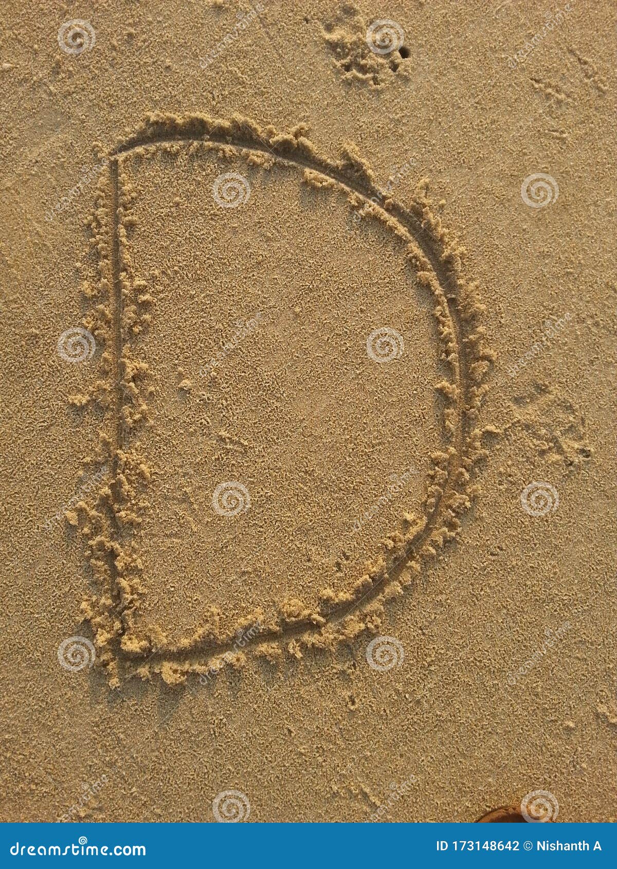Letter D written on beach. stock photo. Image of drawing - 173148642
