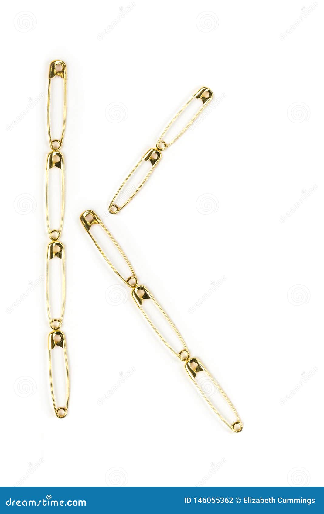 Letter Spelled Out in Gold Colored Safety Pins Stock Photo - Image of ...