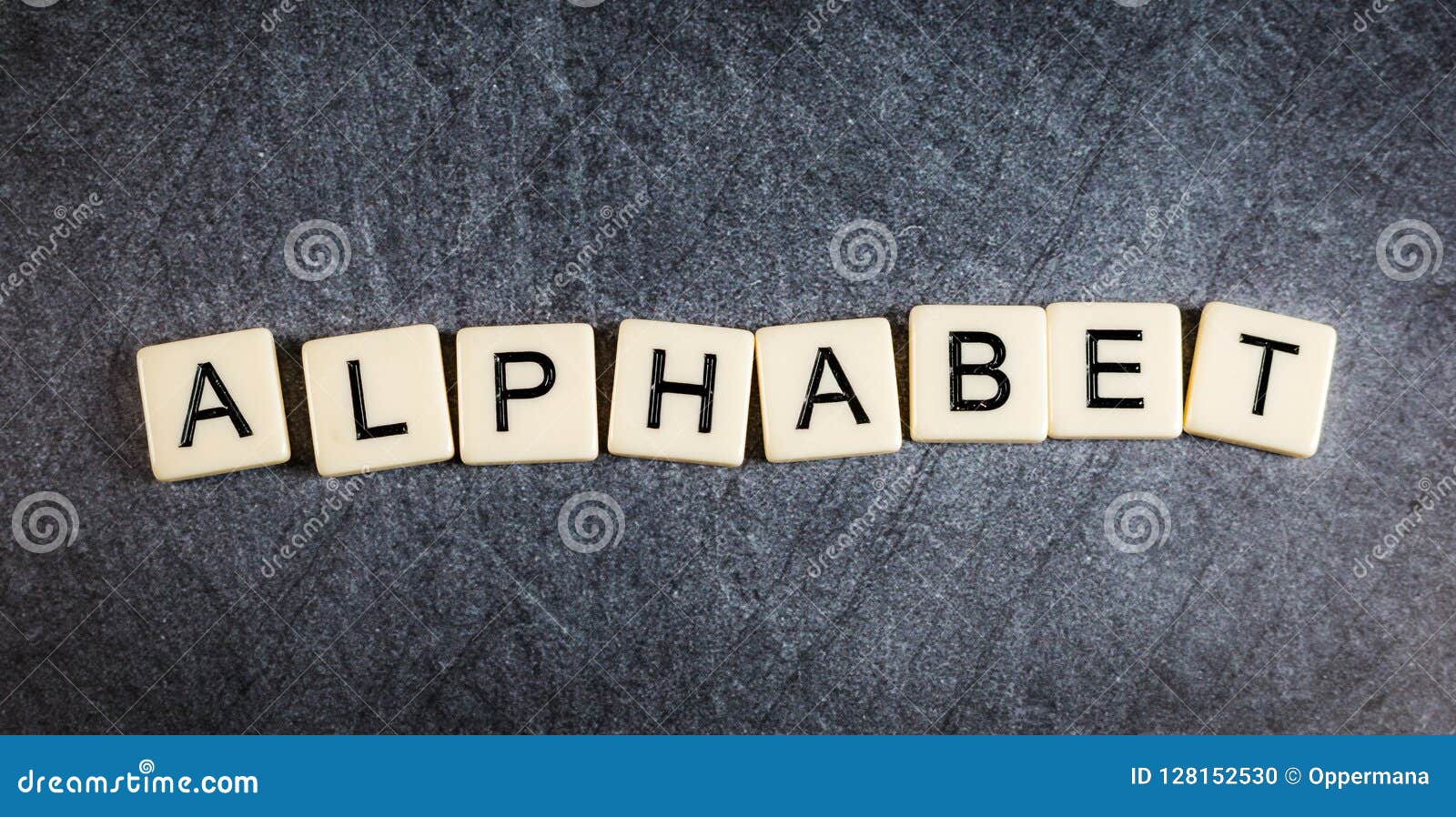 Letter Tiles On Black Slate Background Spelling Alphabet Stock Photo ...
