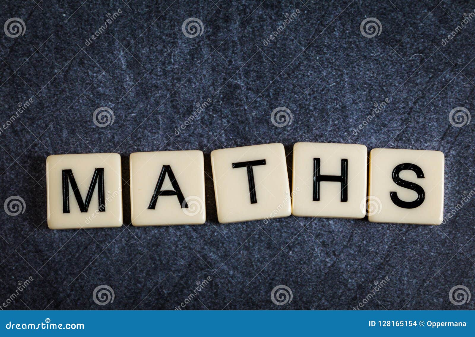 Letter Tiles on Black Slate Background Spelling Maths Stock Photo ...