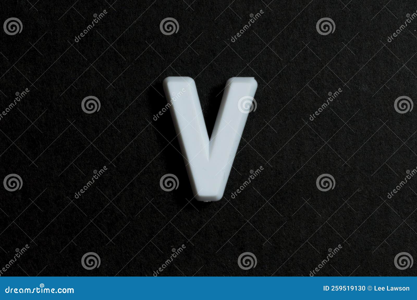 Pegboard letter V on black stock photo. Image of background - 259519130