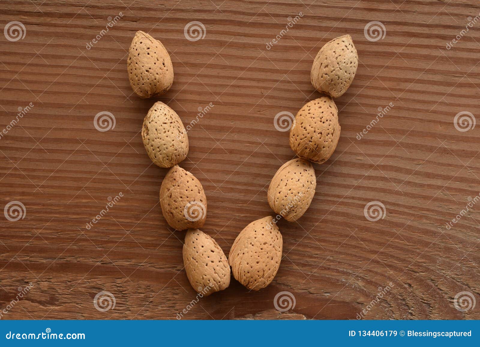 The Letter V Shaped with Almonds on Wood Stock Image - Image of symbol ...