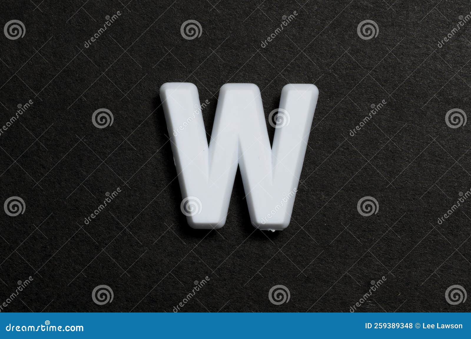 Pegboard Letter W on a Black Background Stock Photo - Image of school ...