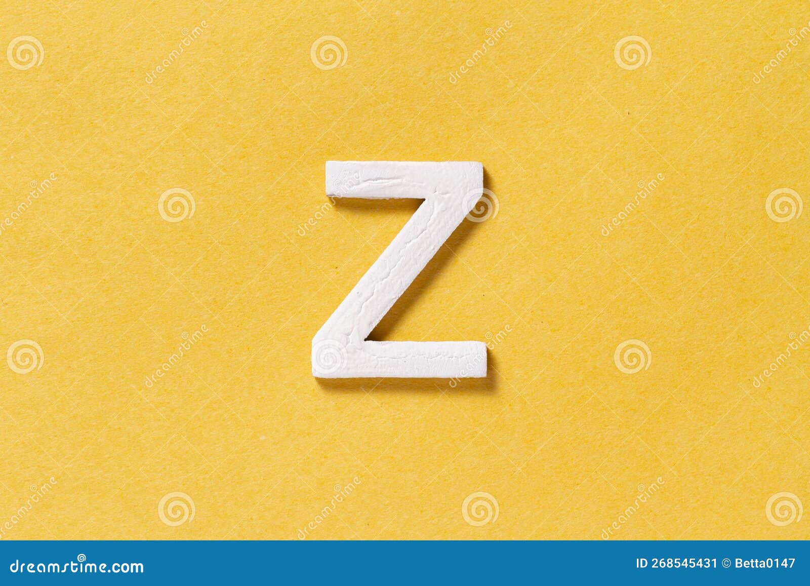 Letter Z of the Alphabet Isolated on Yellow Background, Top View Stock ...