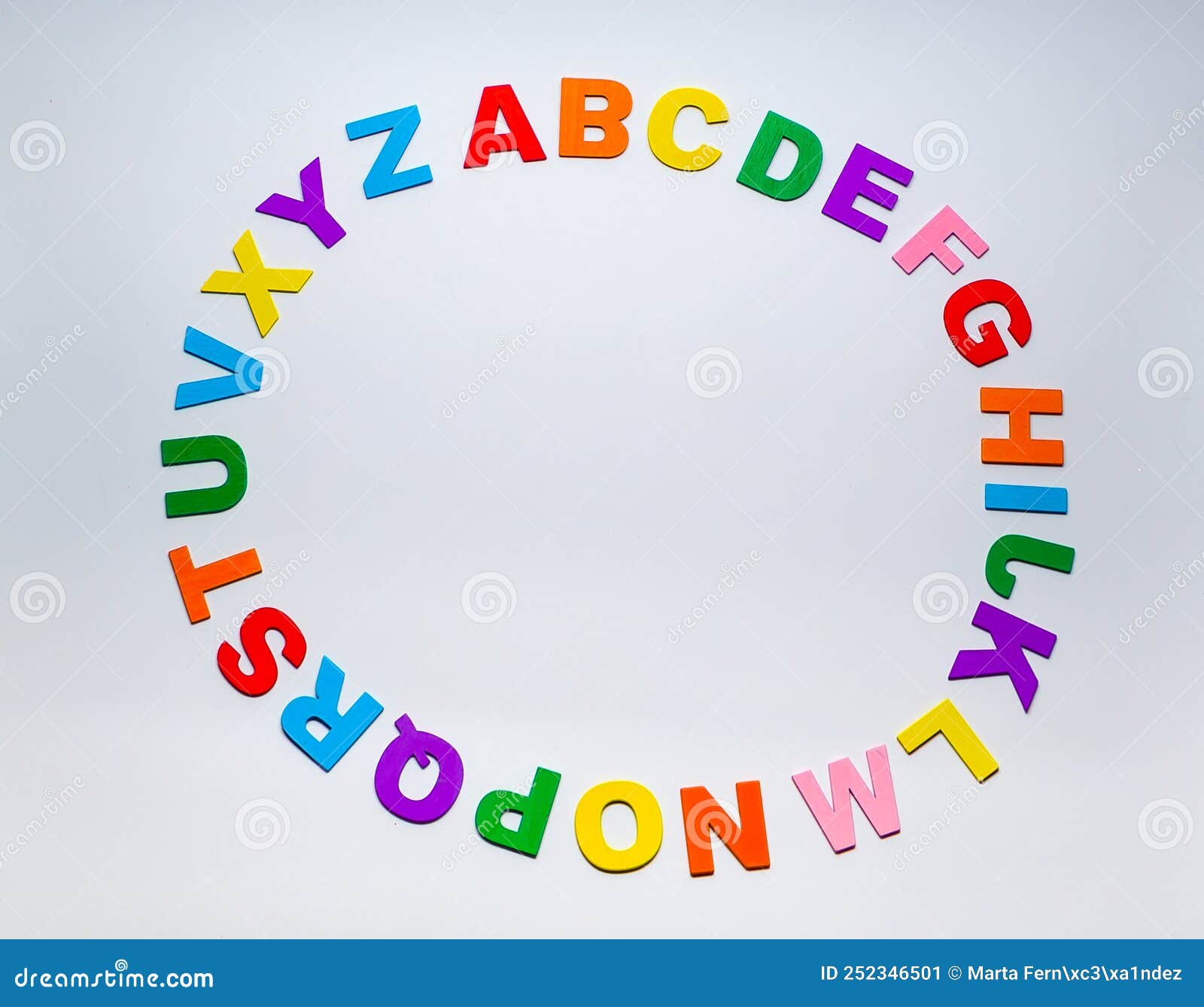 T Alphabet In Circle Of Wooden Dolls That Can Complete TEAMWORK Word On ...