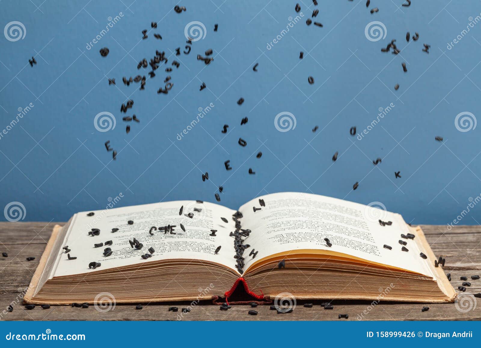 Letters Fall into an Old Open Book Stock Photo - Image of study, school ...