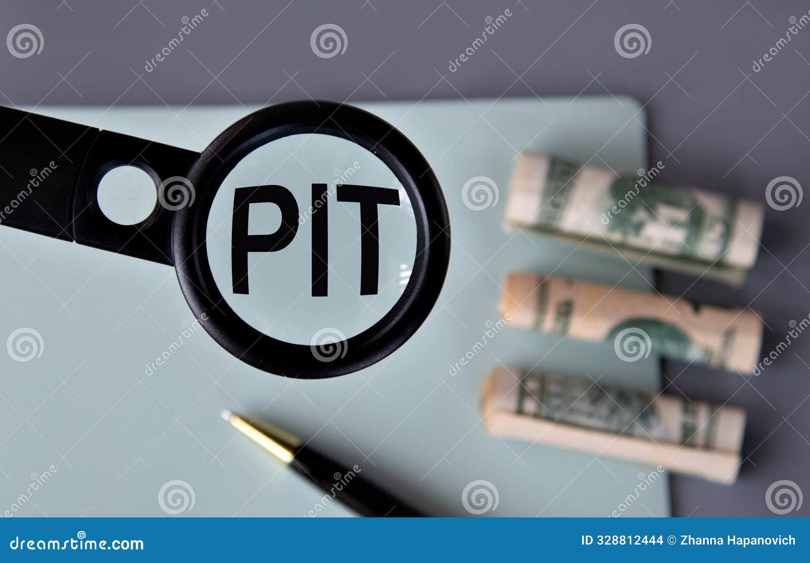 The Letters PIT Under a Magnifying Glass on the Background of Banknotes ...