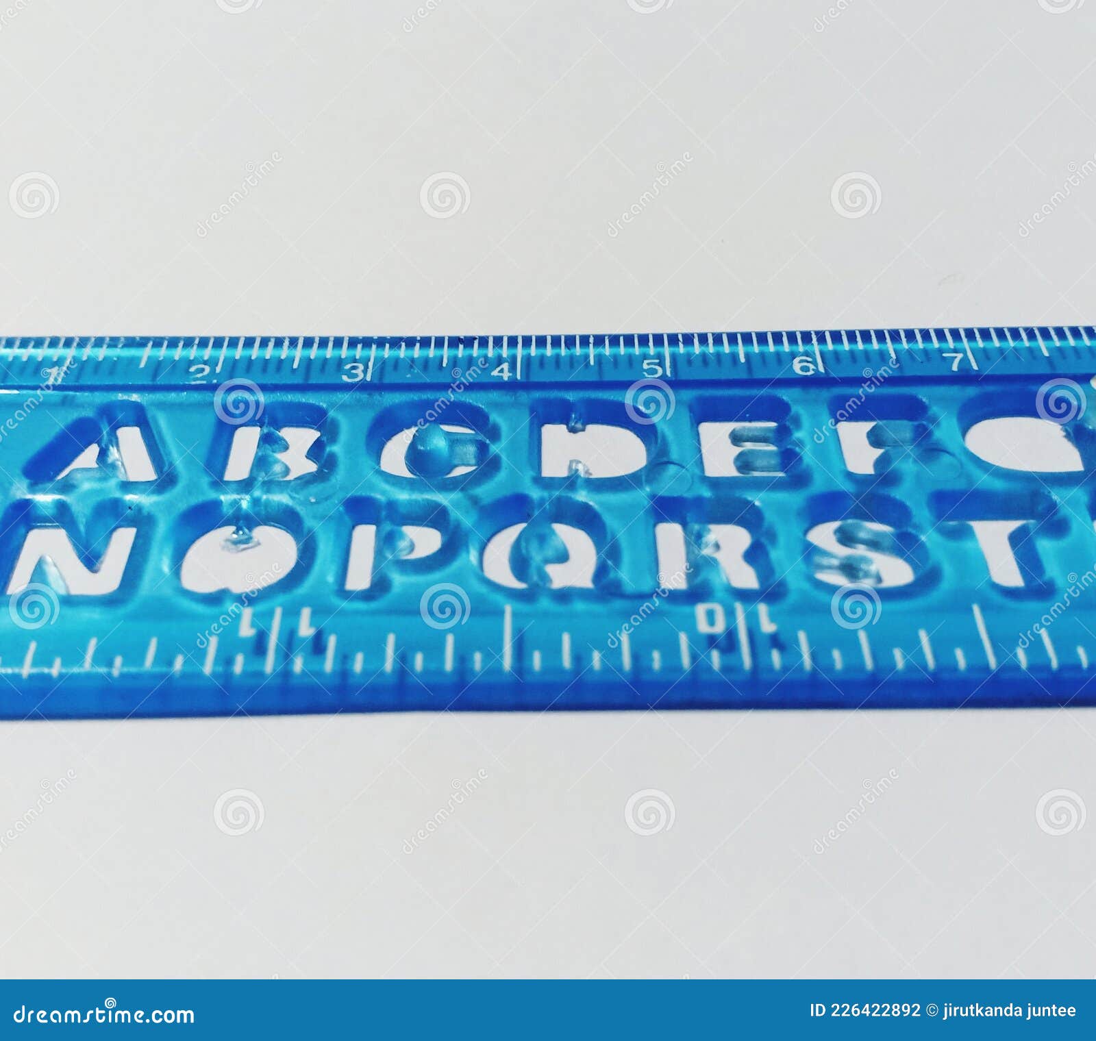 Letters on the ruler stock photo. Image of letters, number - 226422892
