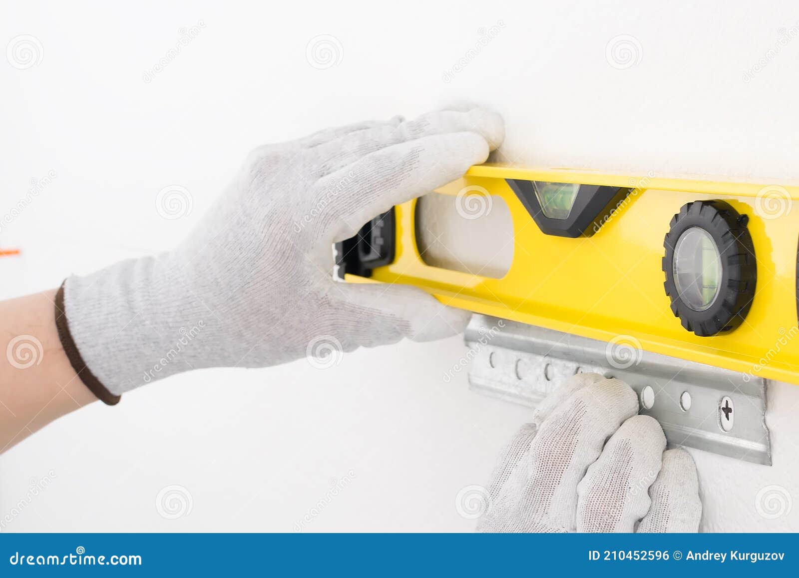 Level Aligns Fasteners for Kitchen Cabinets, Close-up Stock Photo ...