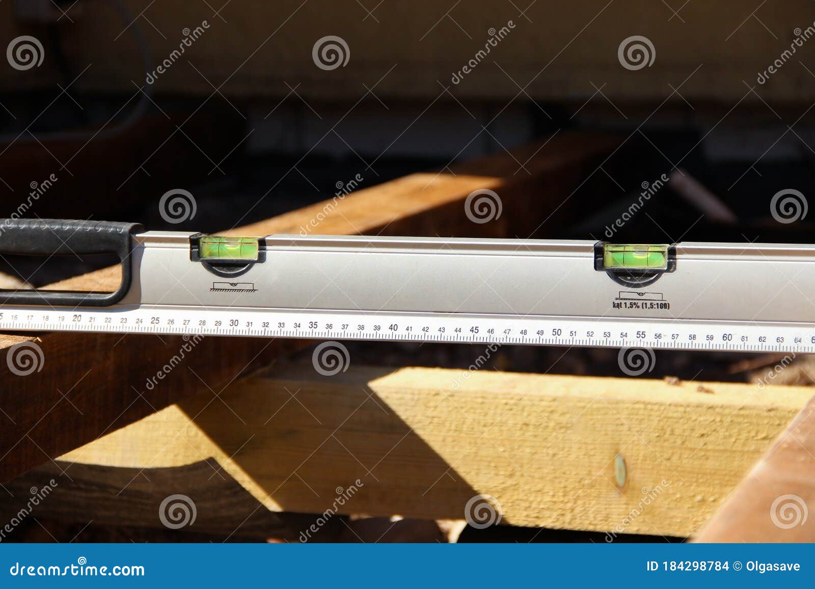 Level Check of Wooden Beam. Building Level in Use Stock Photo - Image ...
