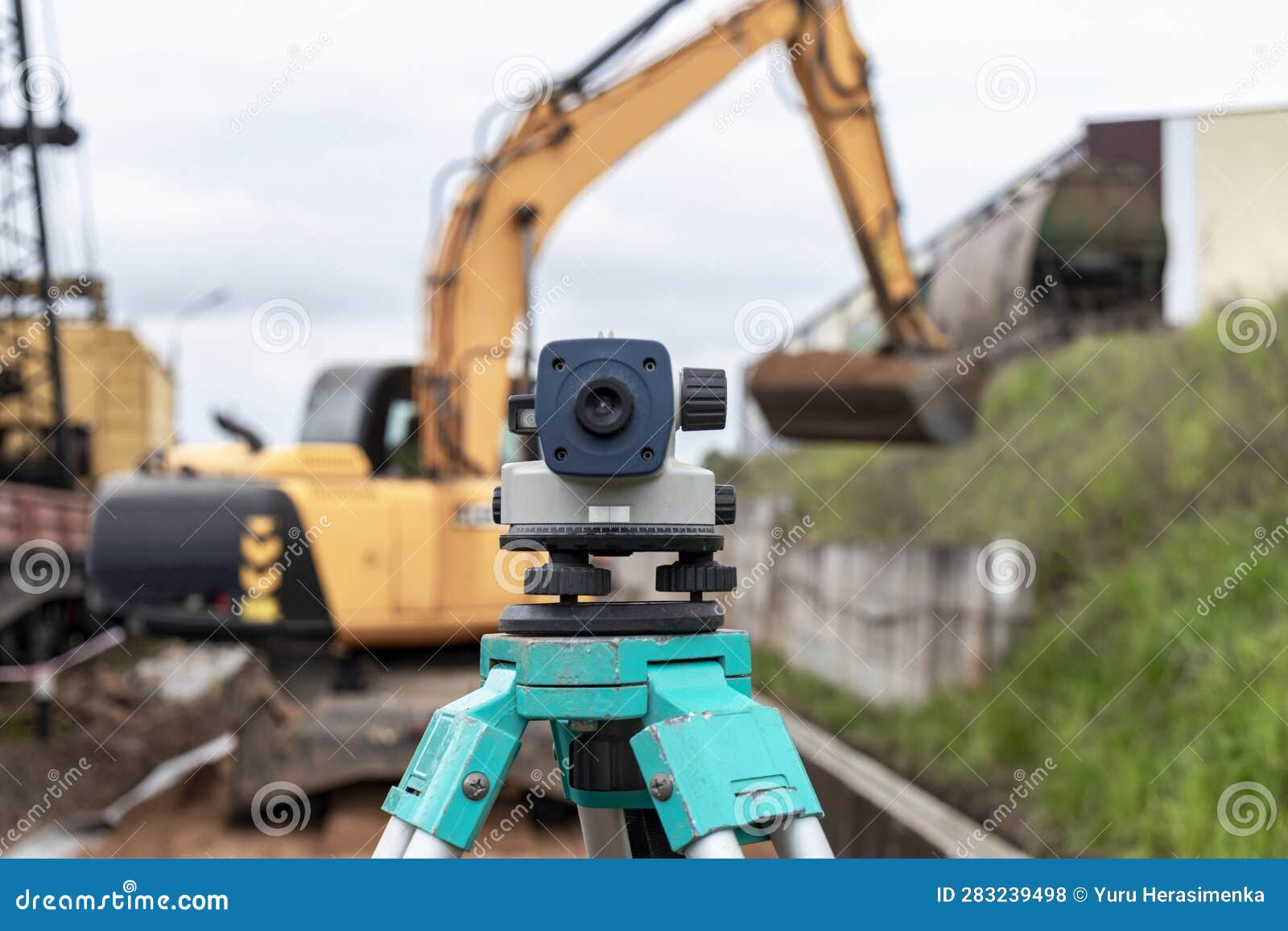 Level with an Excavator in the Background. Construction Level or ...