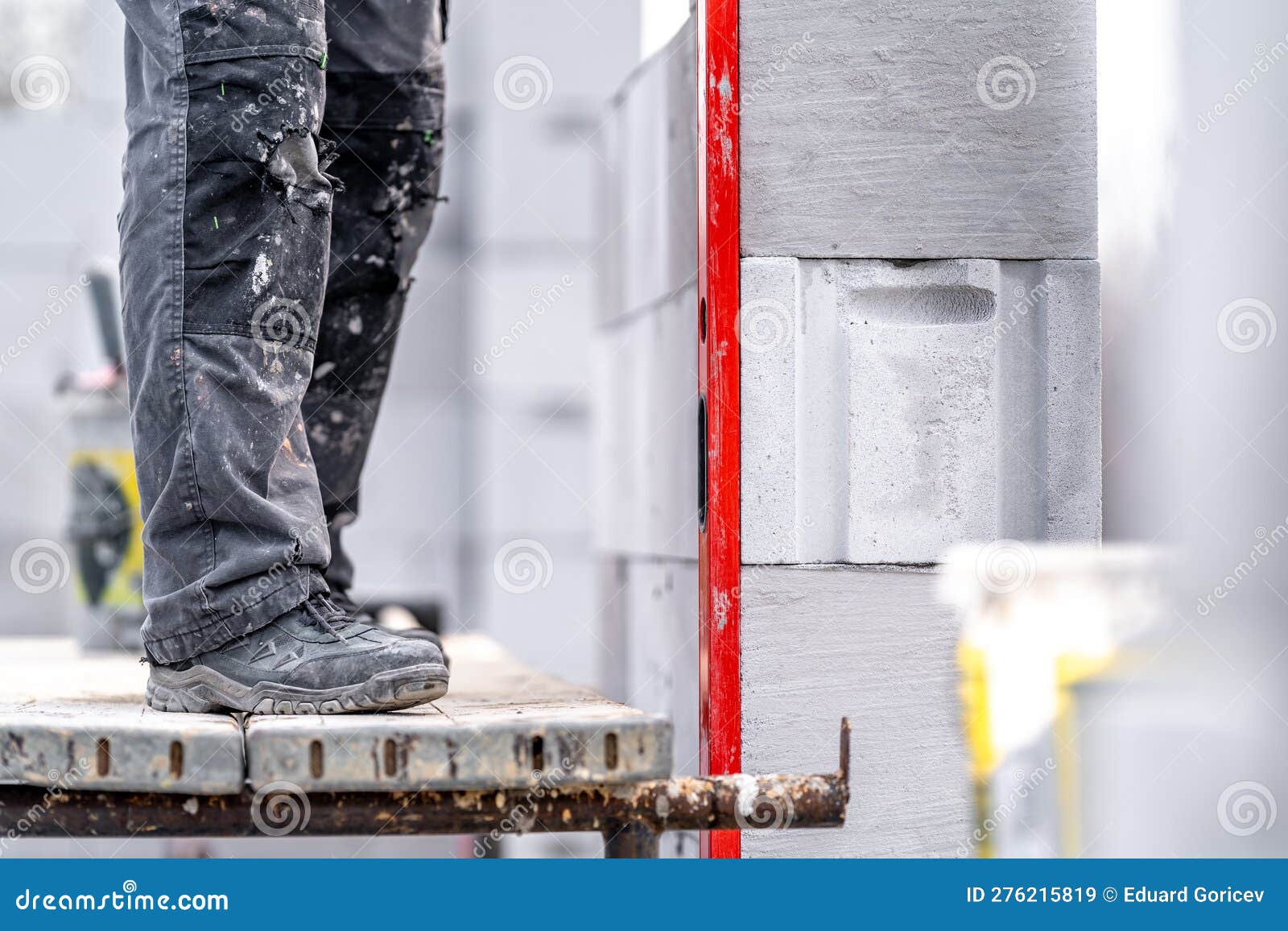Leveling Bricks with the Help of a Spirit Level during the Construction ...
